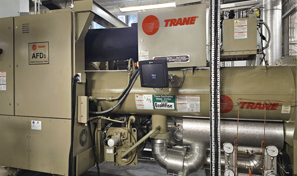 A machine with pipes and a signDescription automatically generated with ...